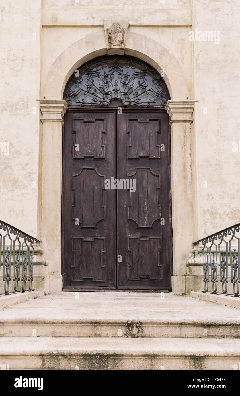 Arched entrance of a medieval palace with carved wooden door Stock ...