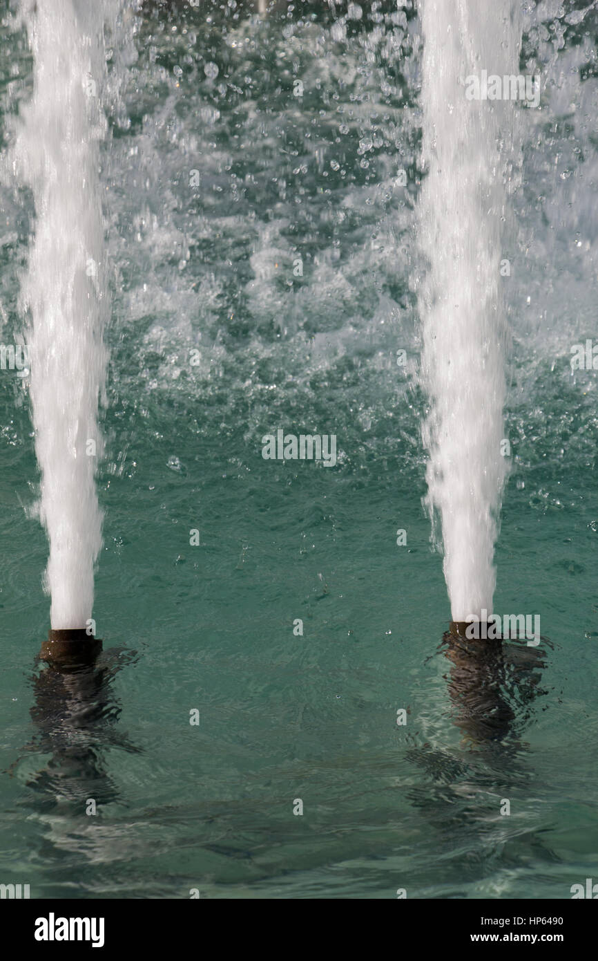 The fountains gushing sparkling water in a pool in a park Stock Photo ...