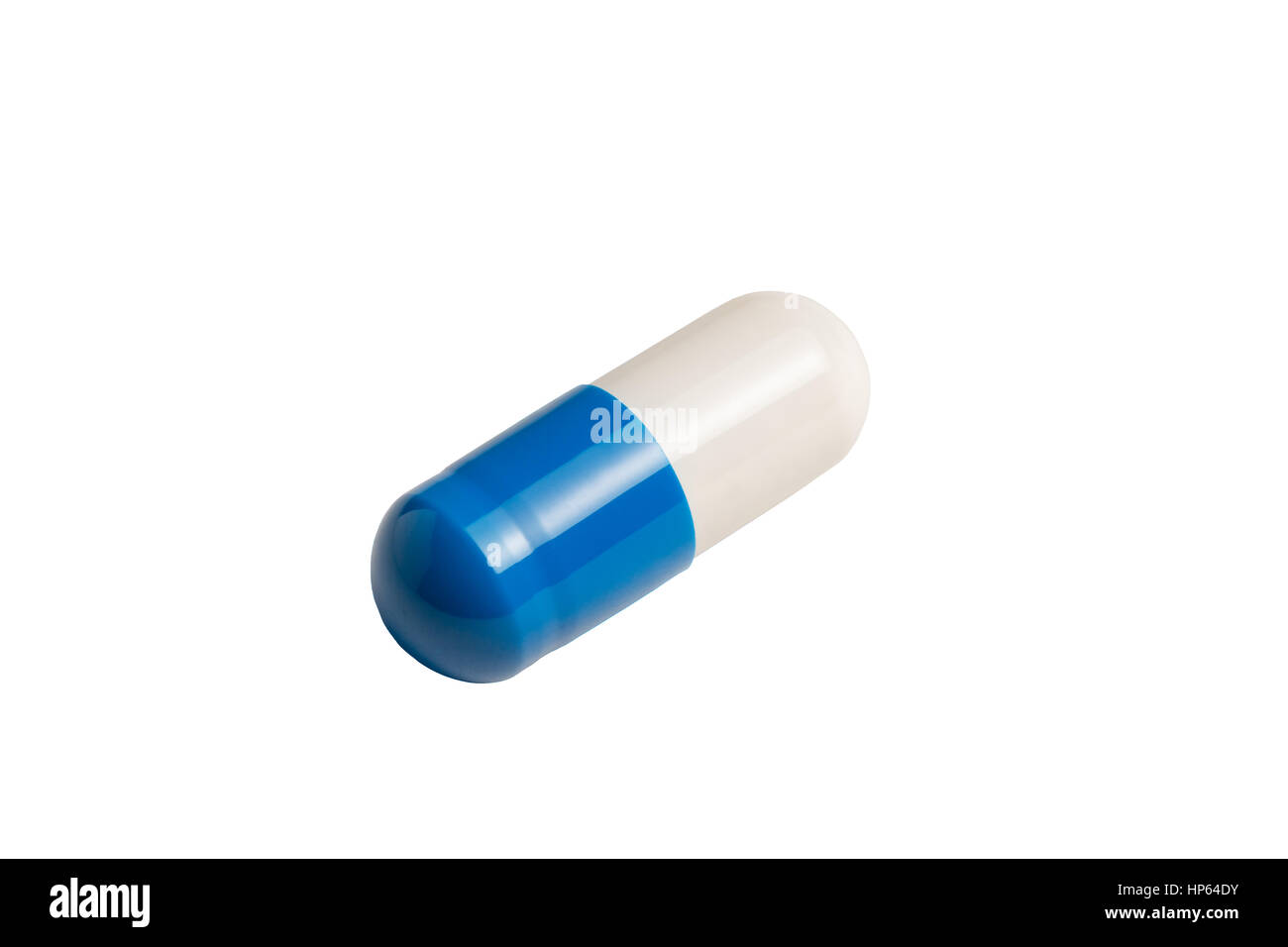 Blue and white pill or capsule isolated on a white background ...