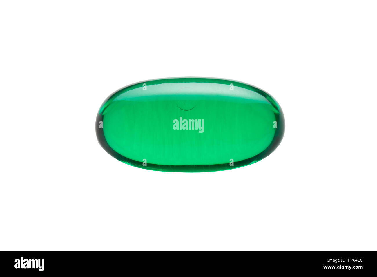 Green gelatin capsule or pill isolated on a white background. Medically ...