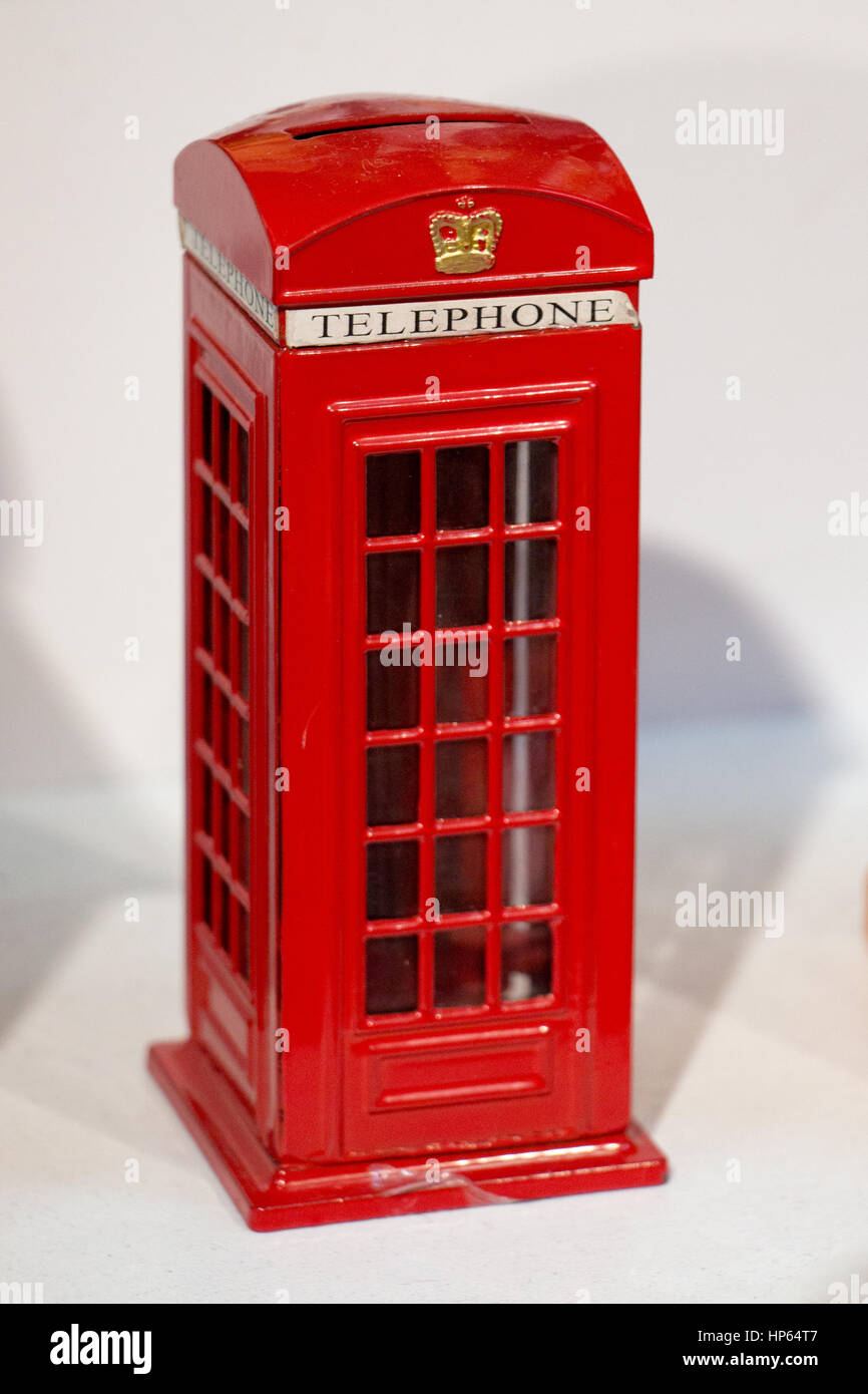 Red color phone booth on a white background Stock Photo - Alamy
