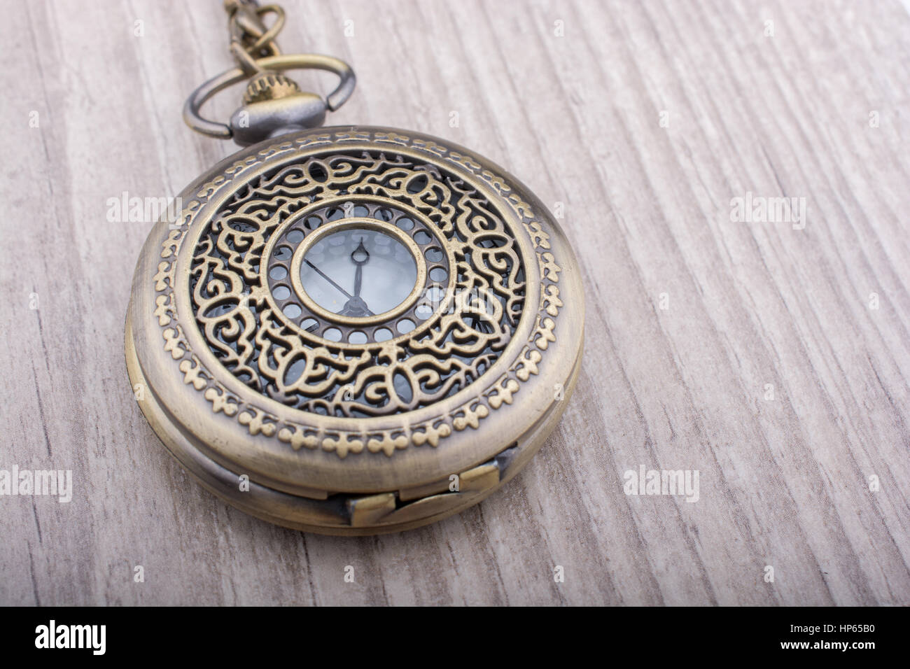 Retro style pocket watch ongrey background Stock Photo - Alamy
