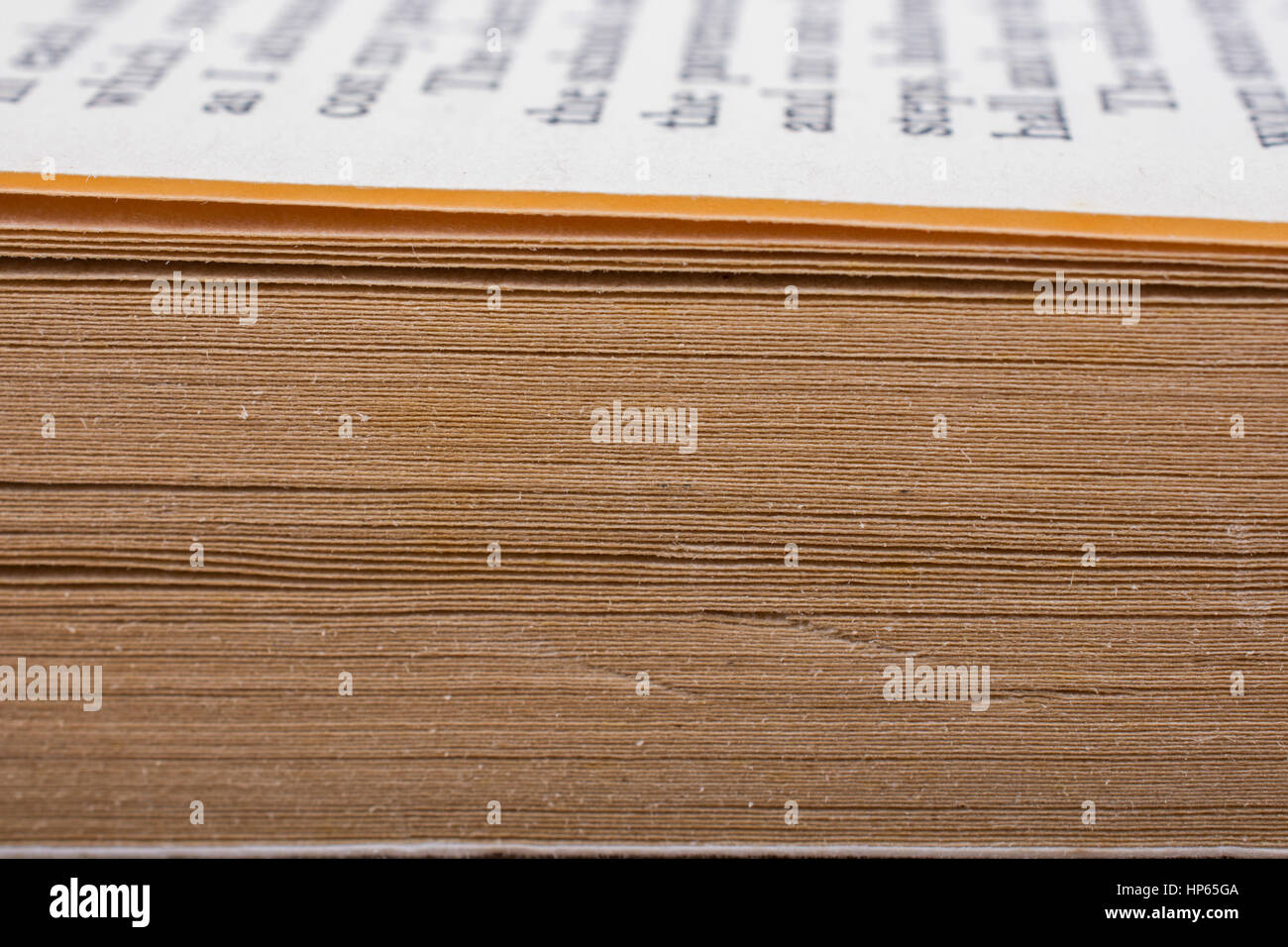 Book pages partly in view on white background Stock Photo - Alamy