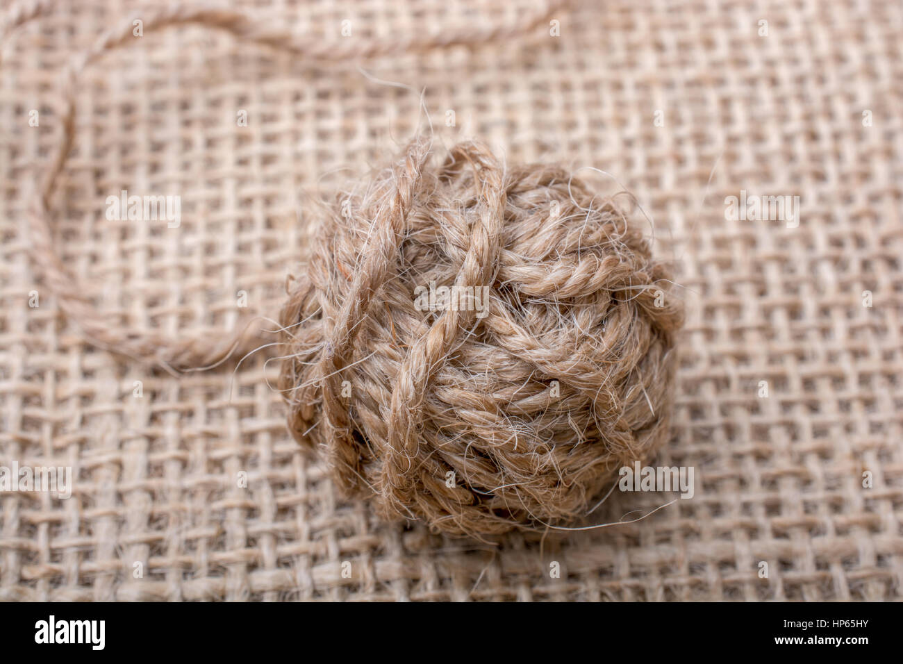 Roll of brown color linen string on brown background Stock Photo - Alamy