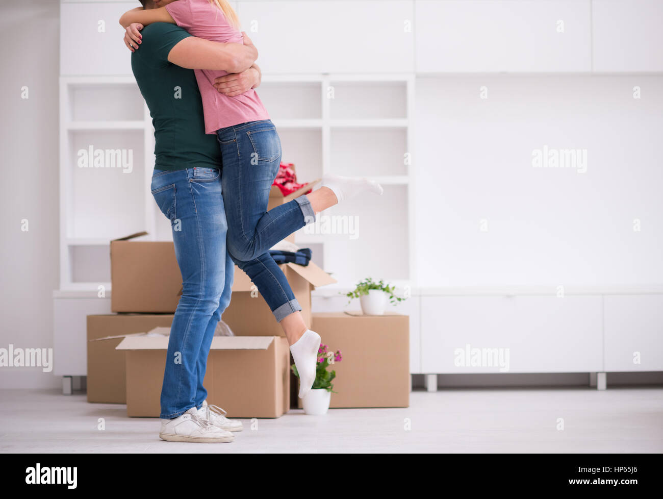 excited happy young couple looking forward to moving into a new home ...
