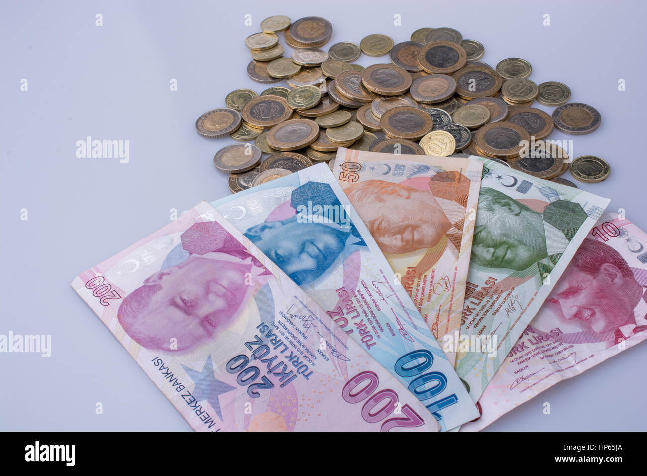 Turkish Lira coins and banknotes side by side on white background Stock ...