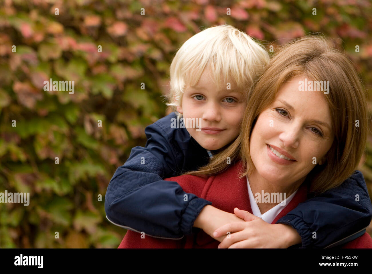 Happy mother hugging her son outside Stock Photo - Alamy