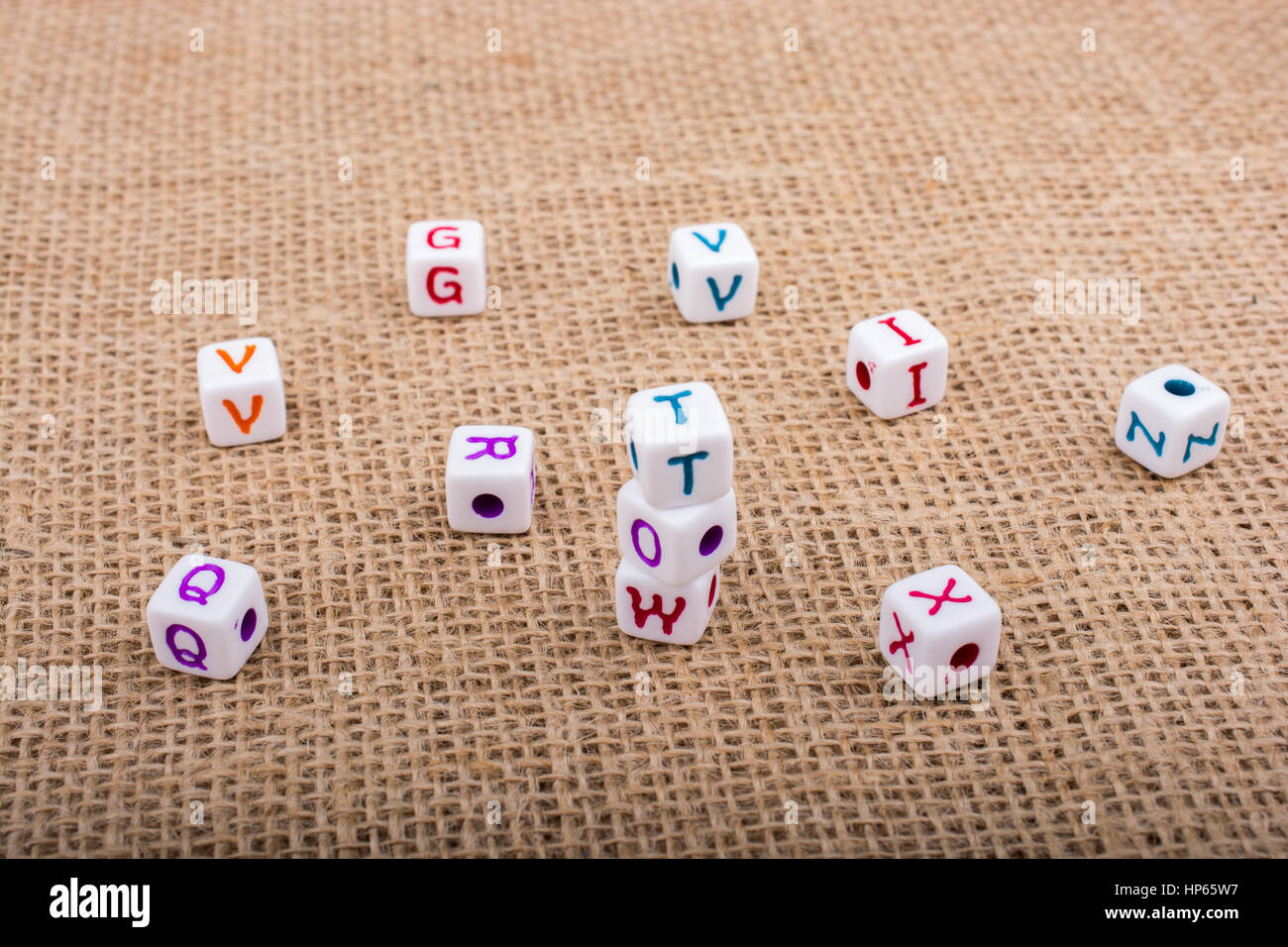 Colorful alphabet letter cubes on a linen canvas Stock Photo - Alamy