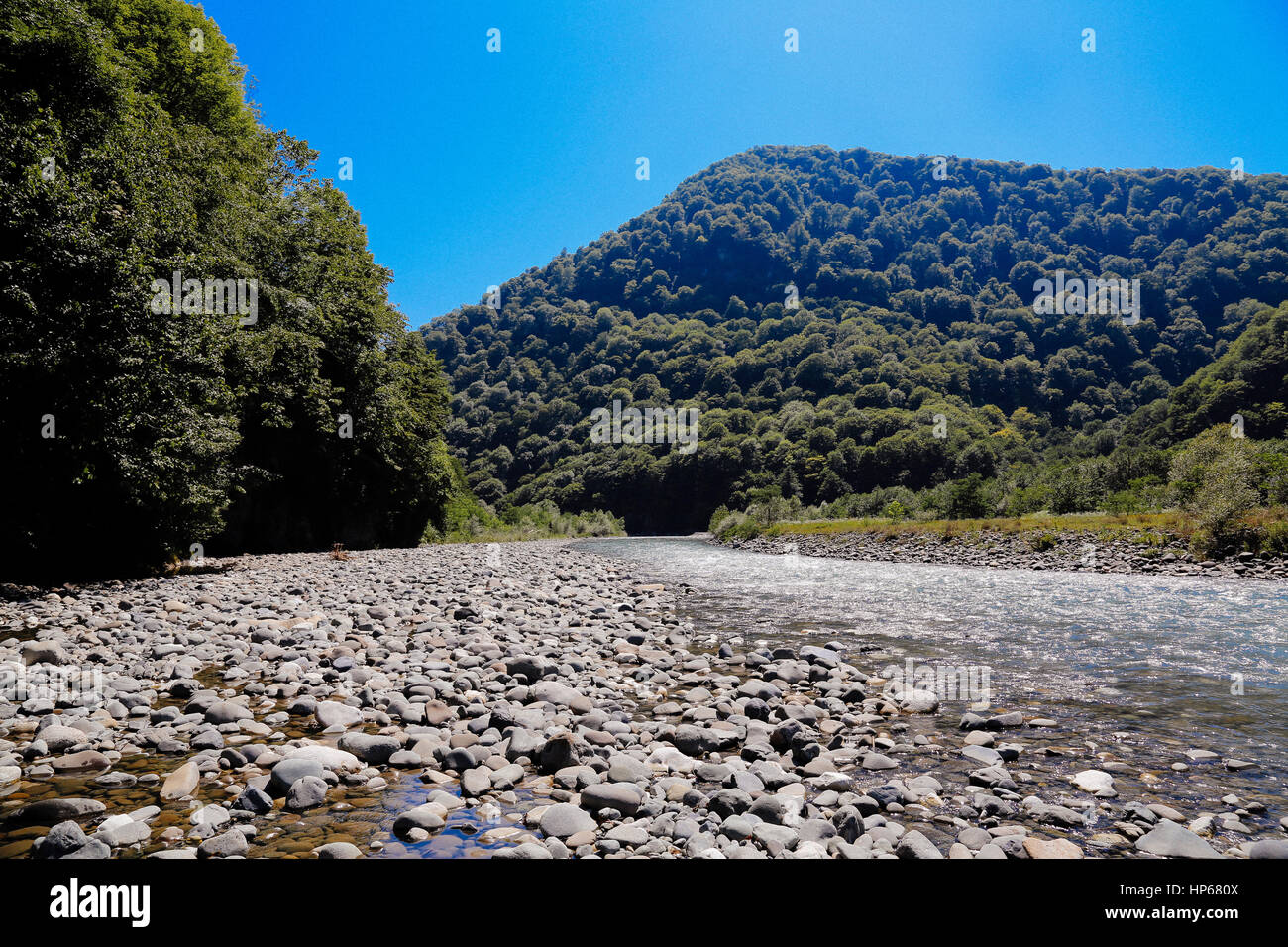 cold mountain river flowing past rocks Stock Photo - Alamy