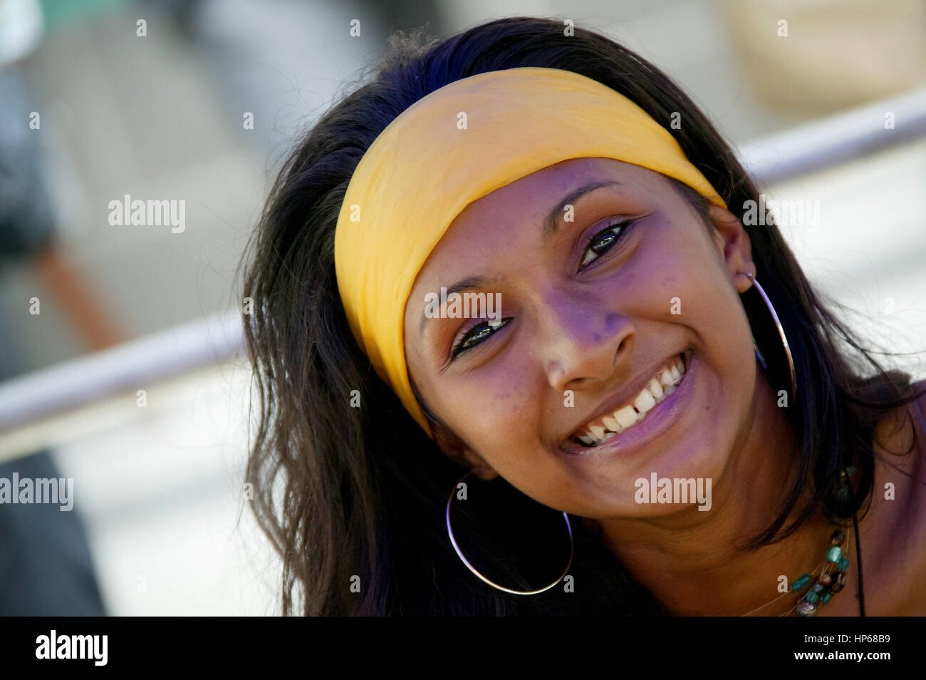 Smiling young woman, Caudan waterfront in port of capital Port Louis ...