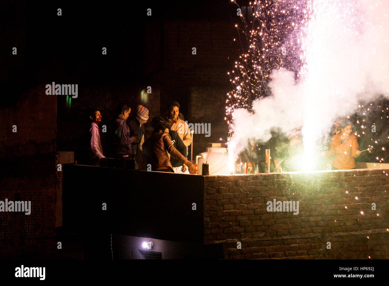 Jaipur, India - 14th Jan 2017 : People enjoying fireworks on a rooftop ...