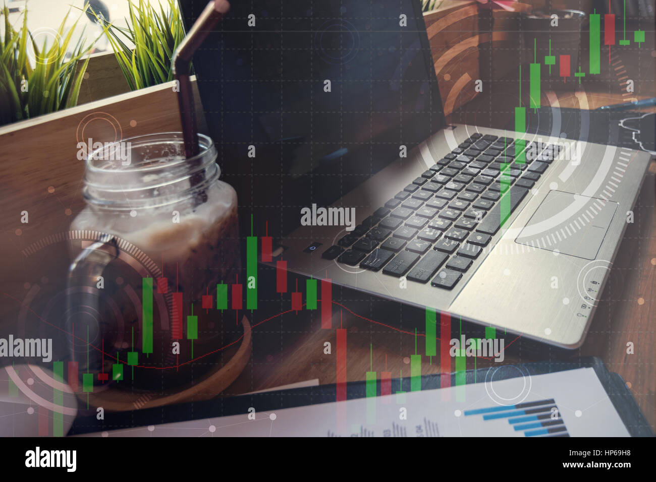 Businessman is working with his computer in coffee shop with stock ...