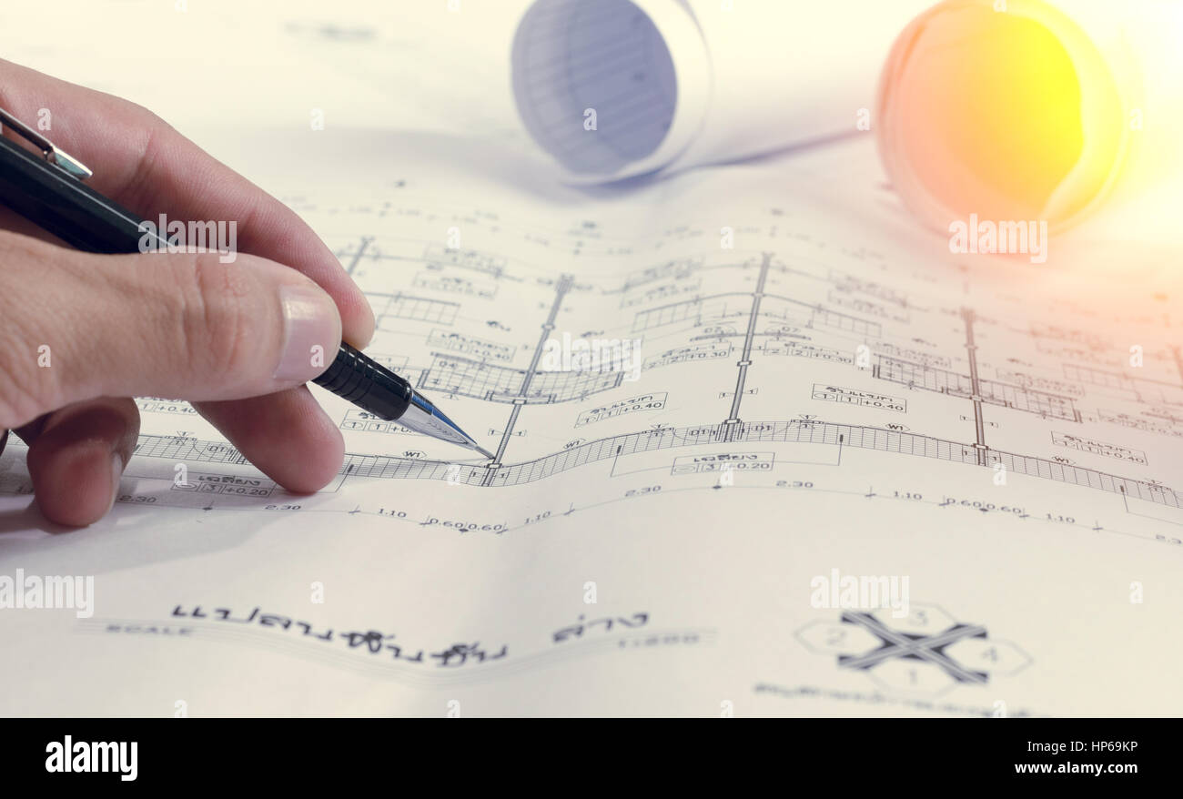 Architectural blueprints and blueprint rolls and a drawing instruments ...