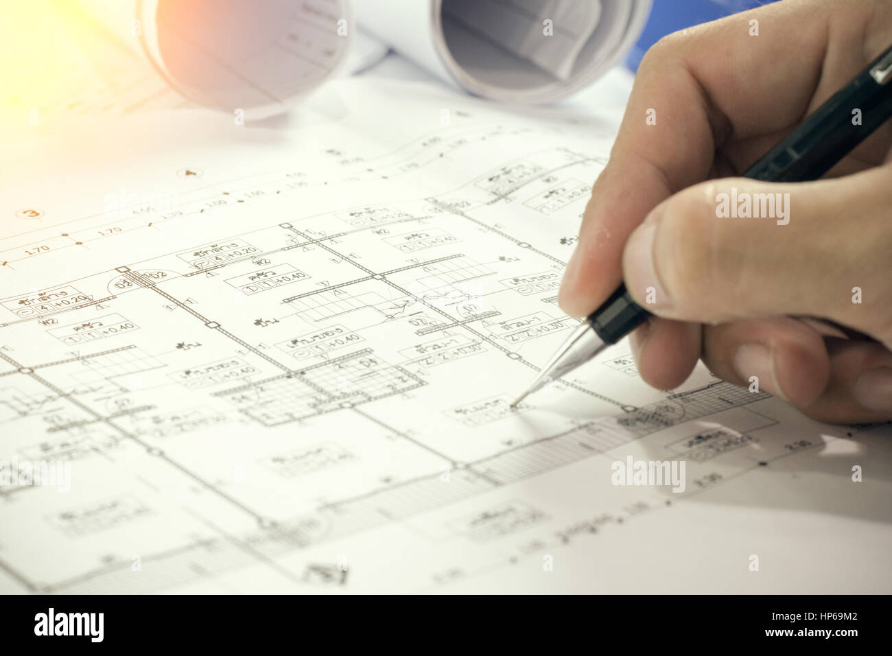 Architectural blueprints and blueprint rolls and a drawing instruments ...