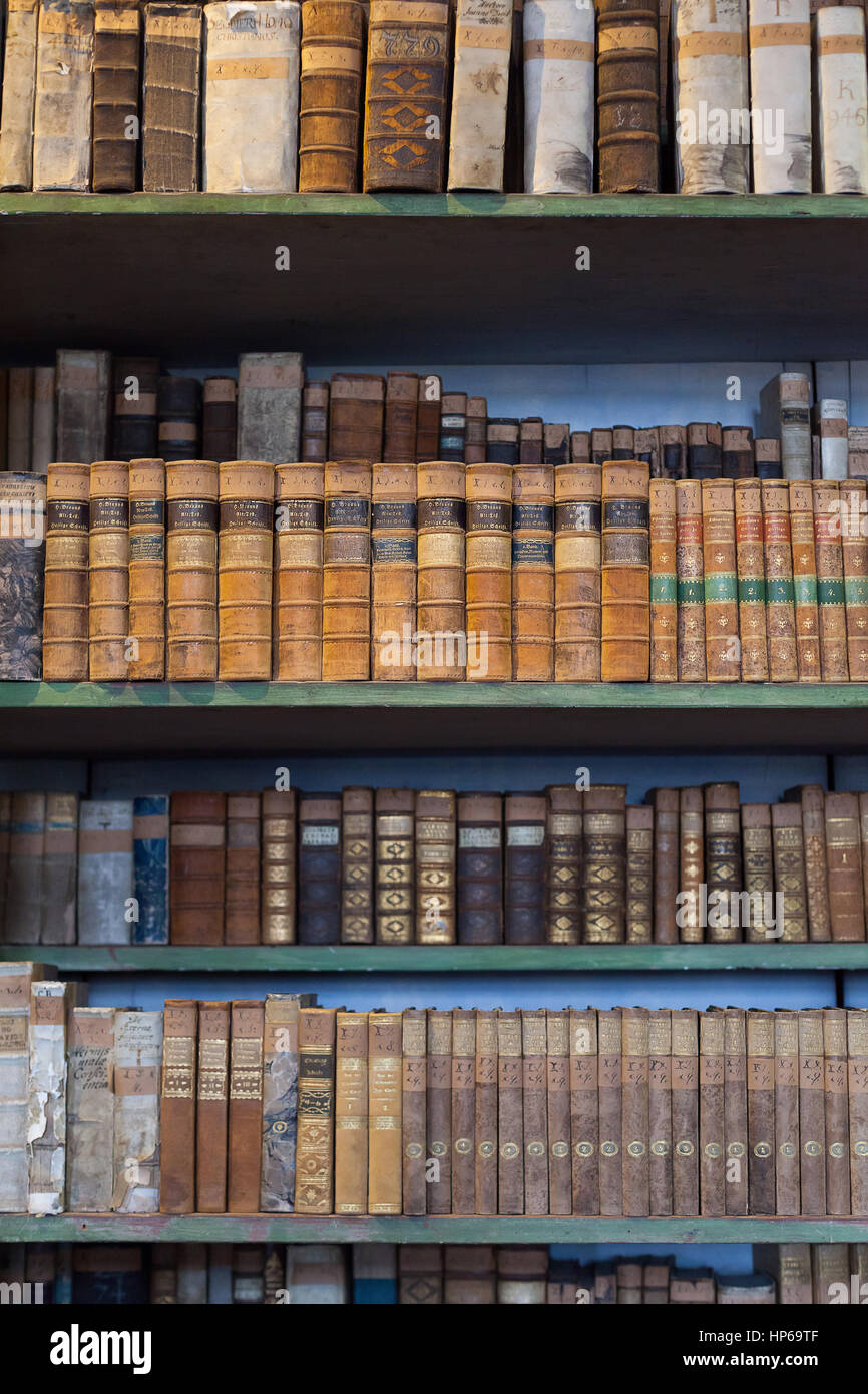historic old books in ancient library, wooden bookshelf Stock Photo - Alamy