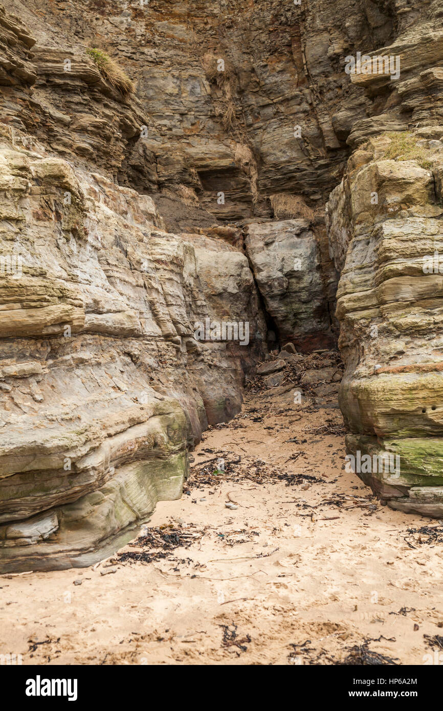An alcove in the cliff face at Staithes, North Yorkshire,UK Stock Photo ...