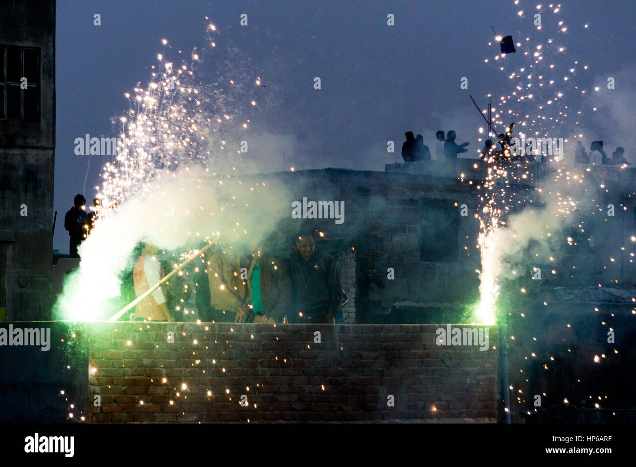 Jaipur, India - 14th Jan 2017 : People enjoying fireworks on a rooftop ...