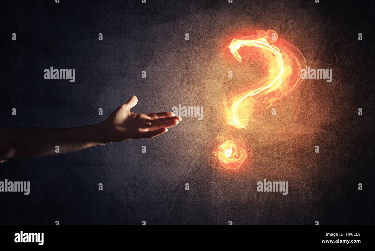 Close of man hand showing burning fire sign on dark background Stock ...