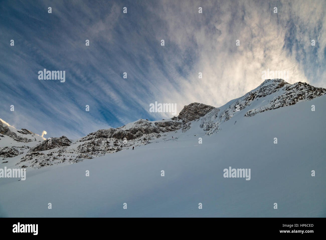 Clouds passing over a snowy mountains peak in the Alps Stock Photo - Alamy