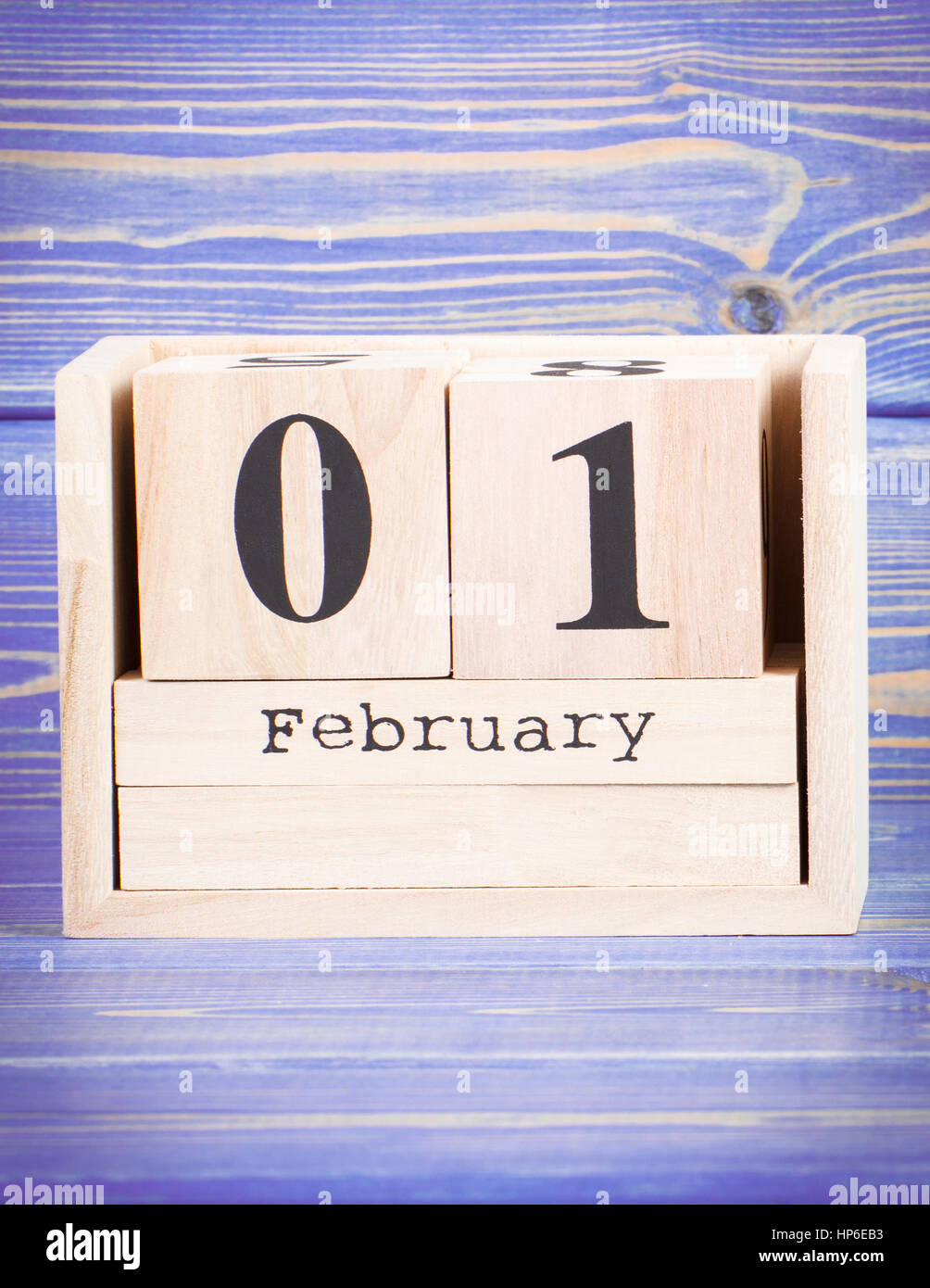 February 1st. Date of 1 February on wooden cube calendar, purple board ...