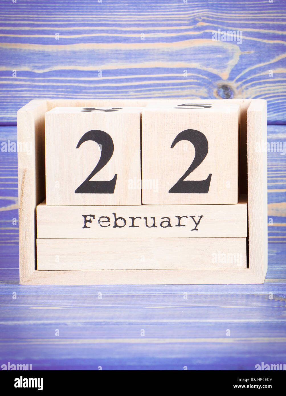 February 22th. Date of 22 February on wooden cube calendar, purple ...