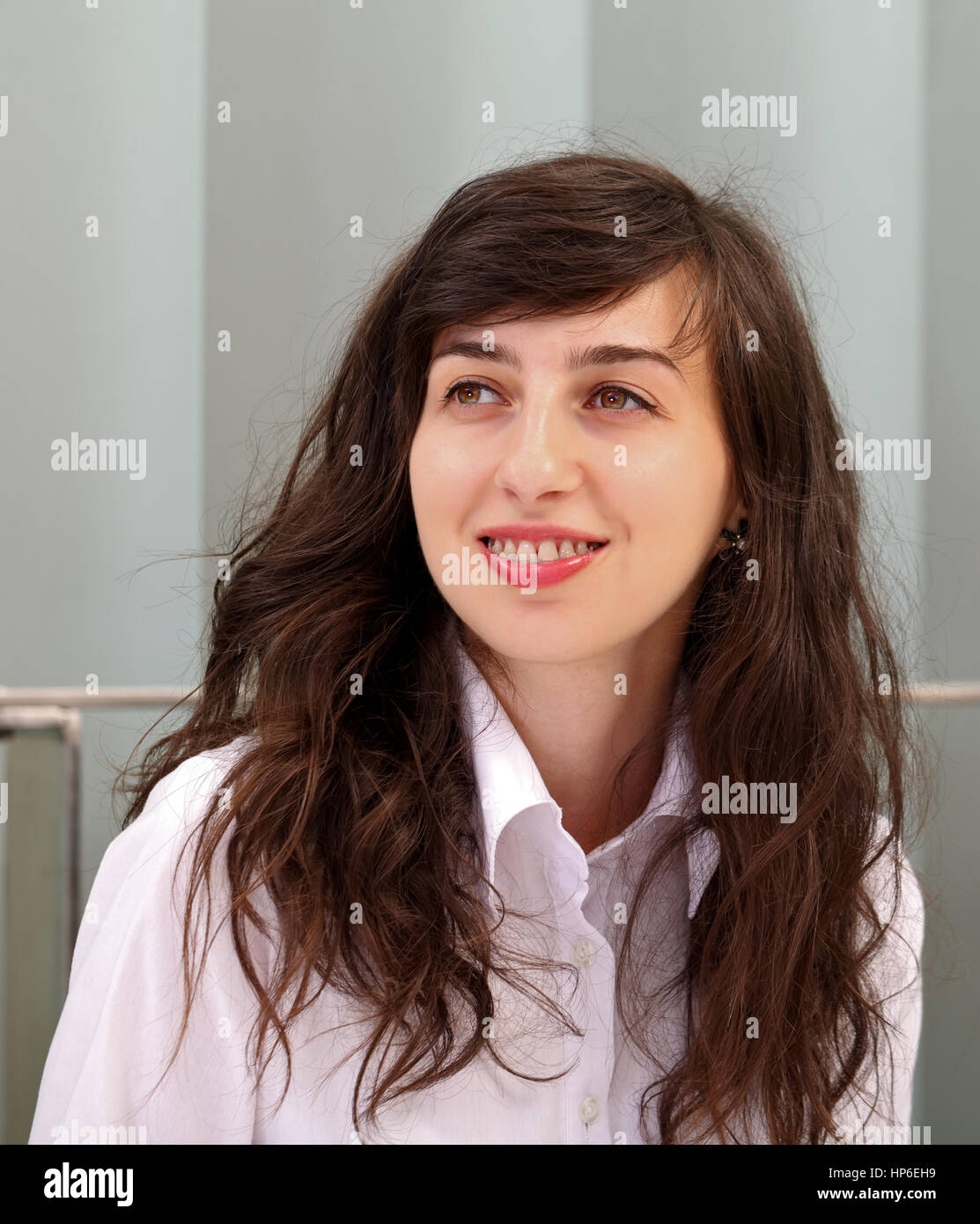 Beautiful secretary woman sitting at her desk Stock Photo - Alamy