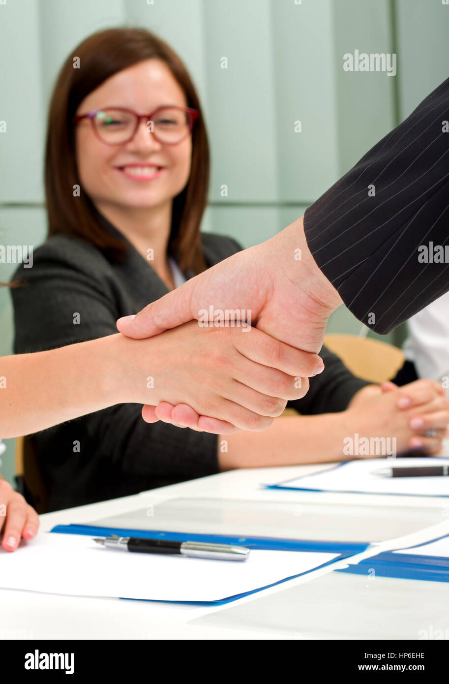 A confident handshake after a successful business Stock Photo - Alamy