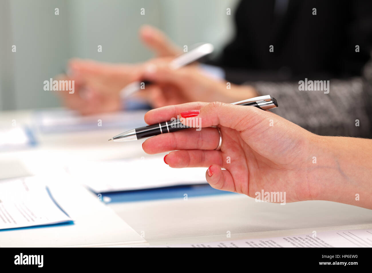 Picture of a woman's hand holding a pen Stock Photo - Alamy