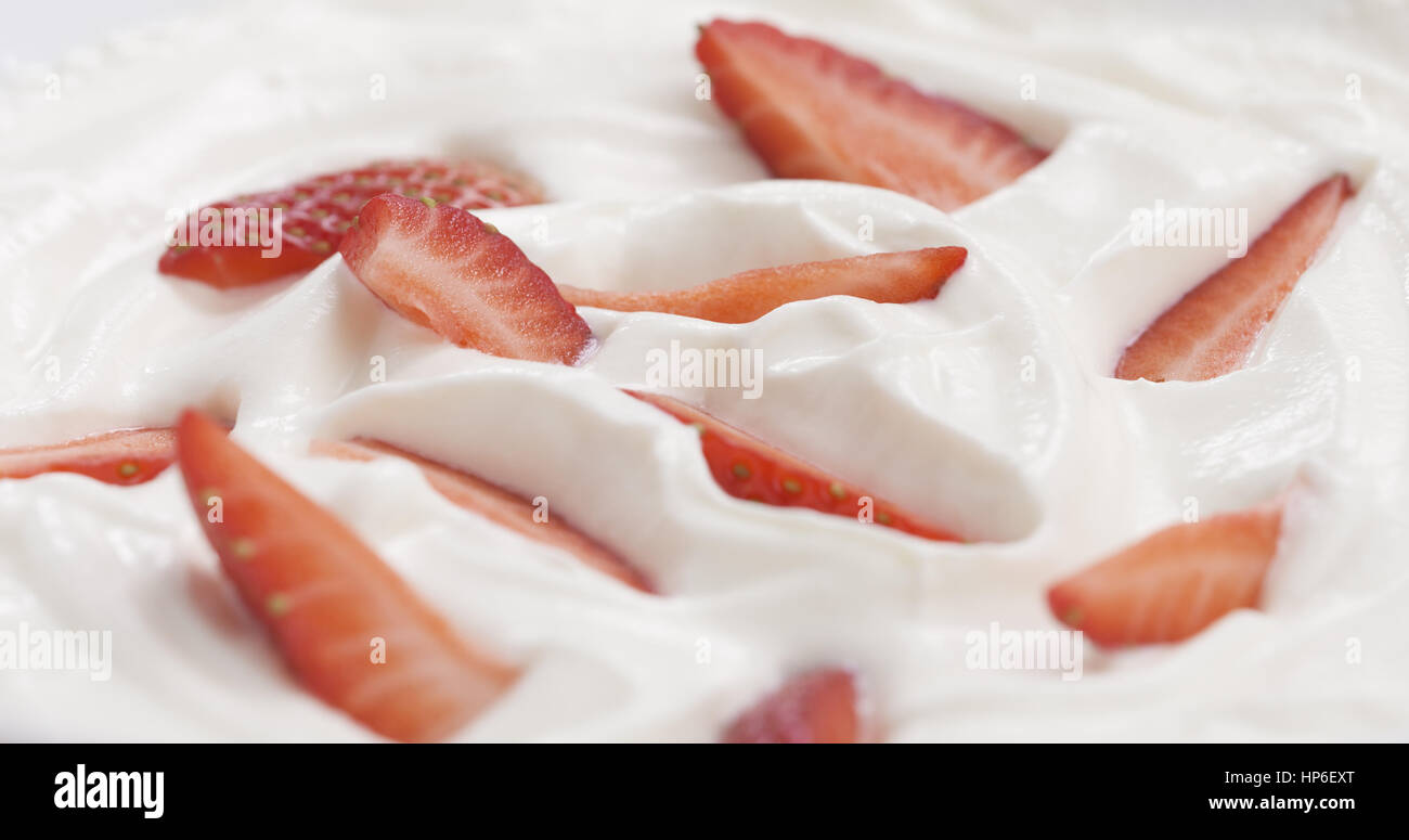 fresh sliced straberries in cream background, 4k photo Stock Photo - Alamy