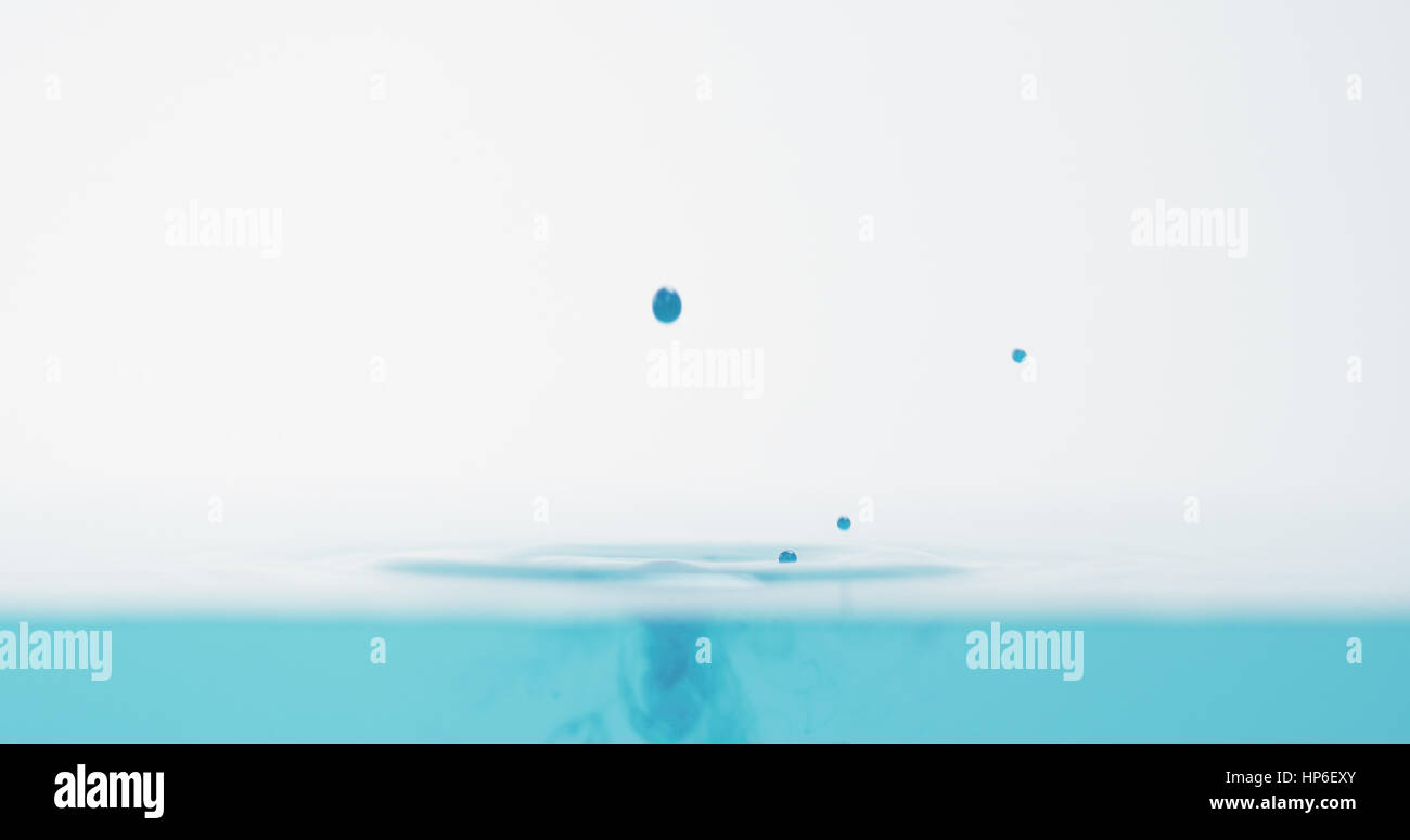 side view of bright blue water drop with accurate splash, 4k photo ...