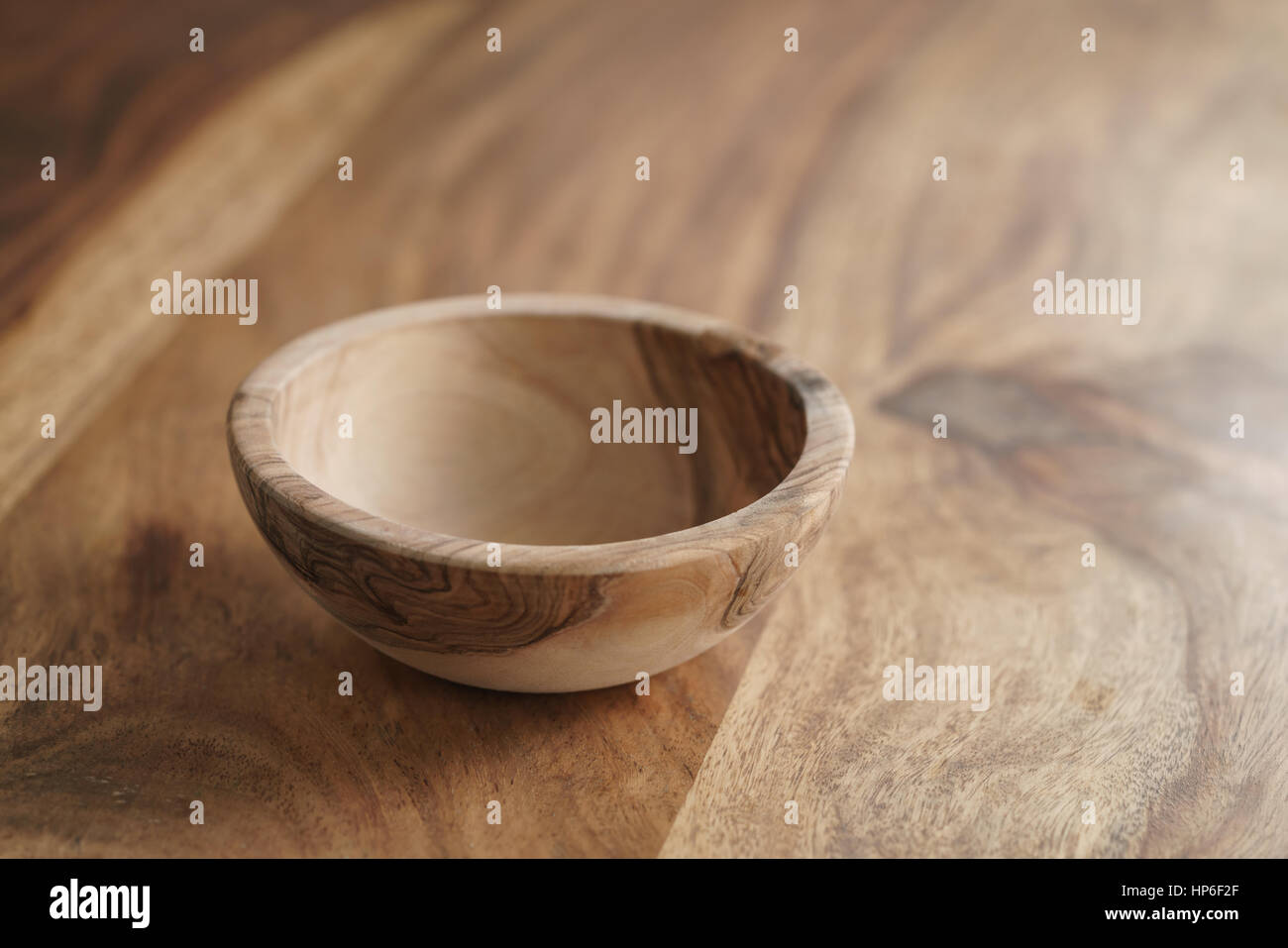 empty olive wood bowl on table, with copy space Stock Photo - Alamy