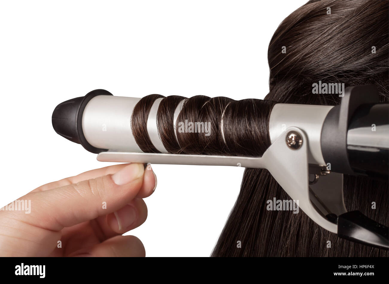 hair curling process. Hairdresser woman curls her hair. Creating ...