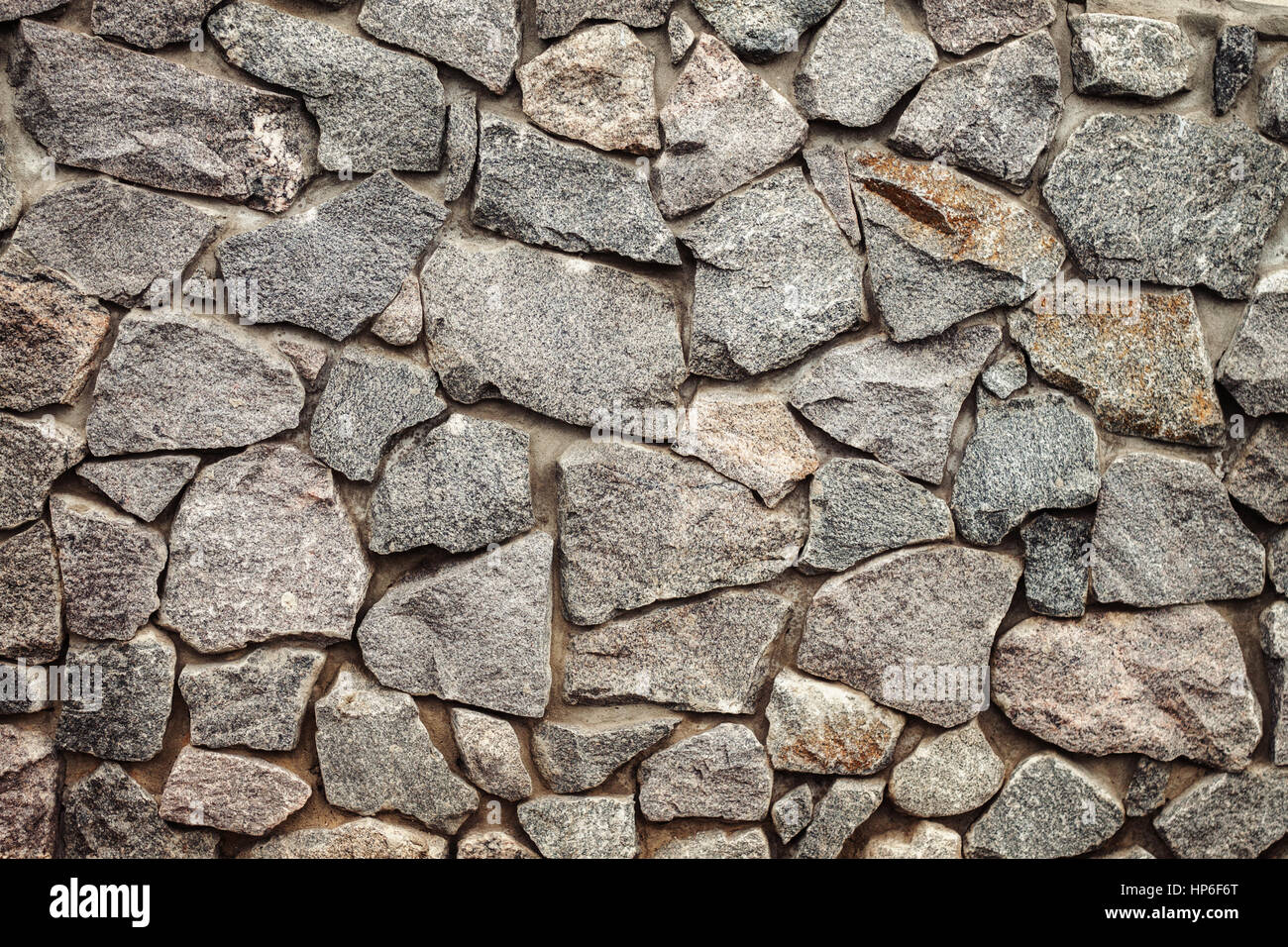 pattern gray color of stone wall surface with cement. Old stone wall ...