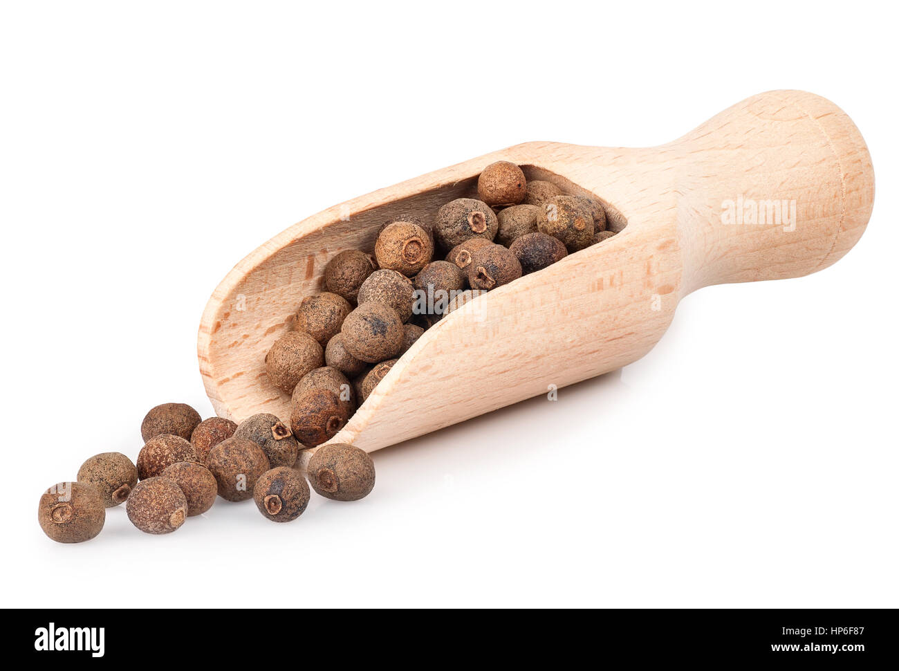 pimento peppercorns in wooden scoop isolated on white background. Whole ...