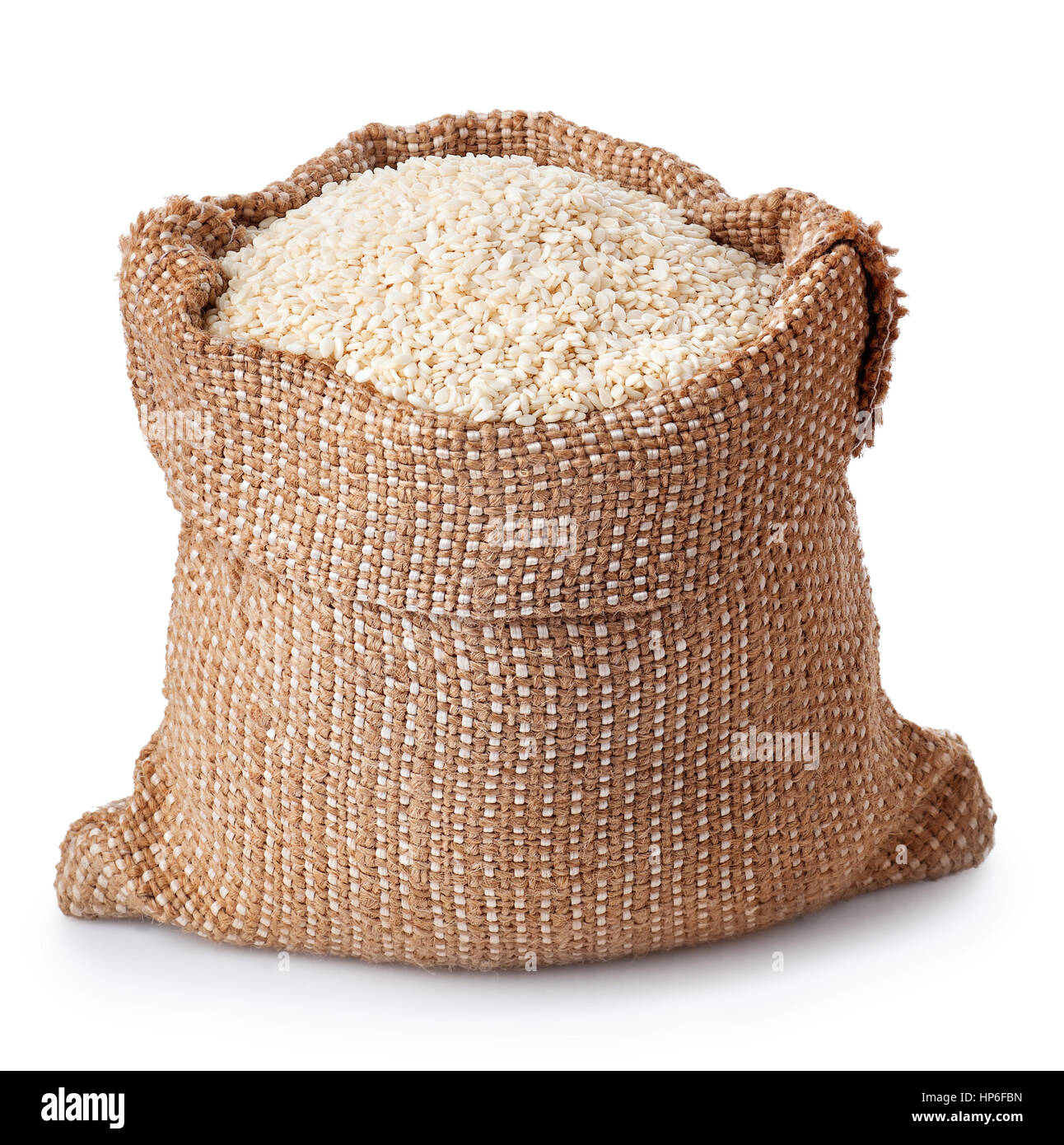 sesame seeds in sack isolated on white background. Full burlap bag with ...