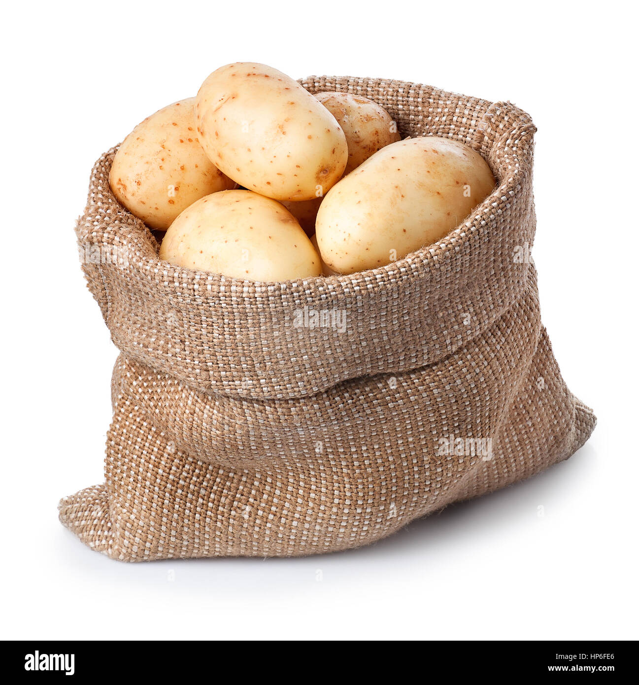 new fresh raw potatoes in bag isolated on white background. Ripe ...