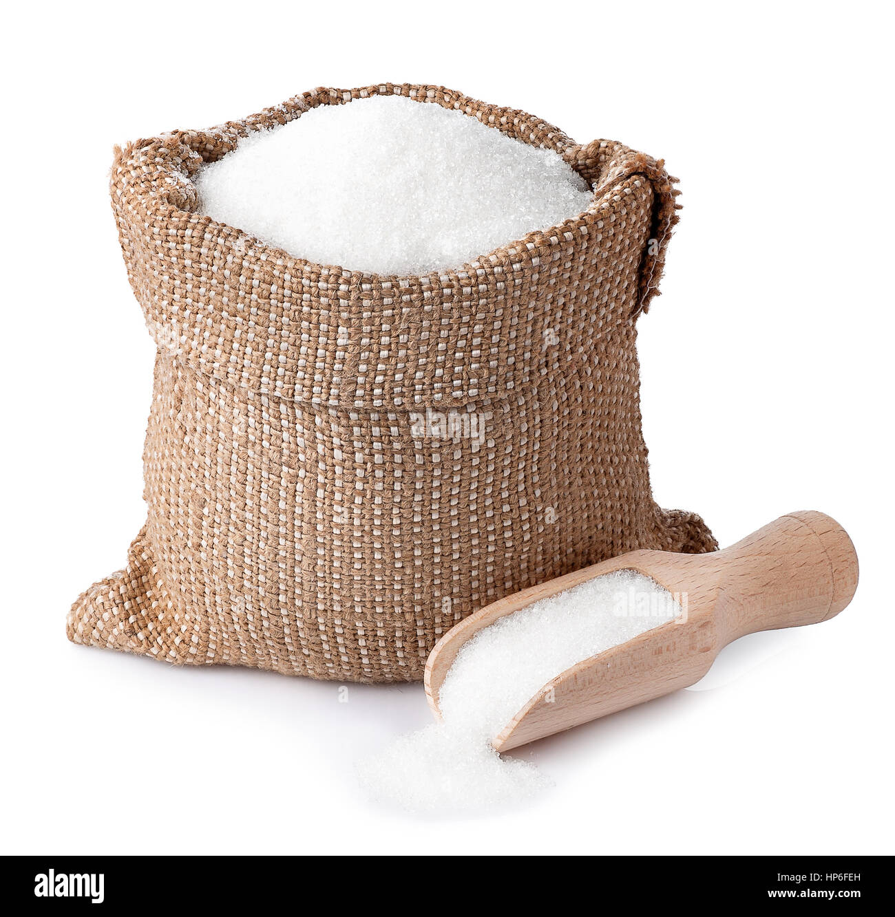 sugar in burlap sack with wooden scoop isolated on white background ...