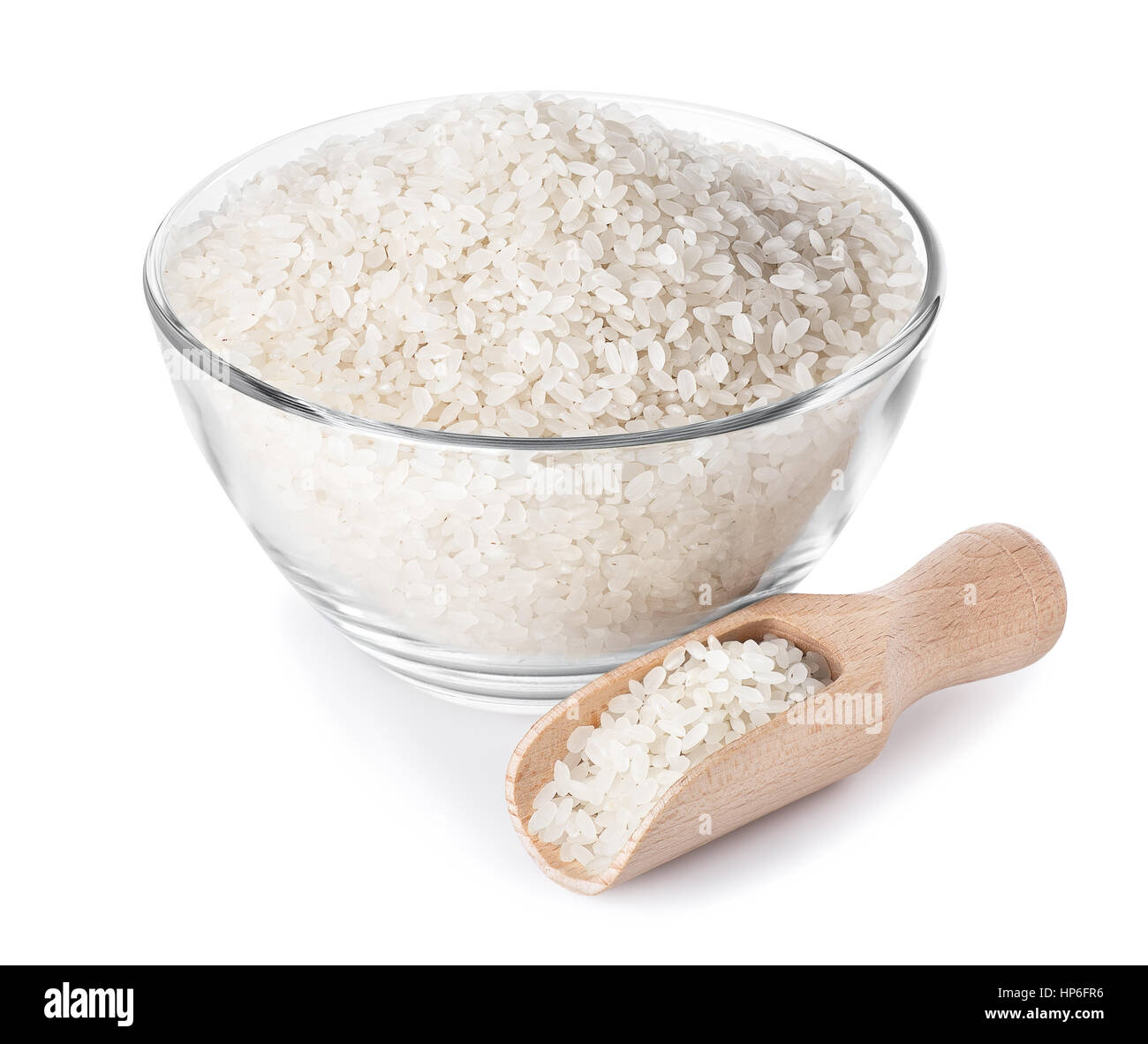 rice in glass bowl with scoop near closeup isolated on white background ...
