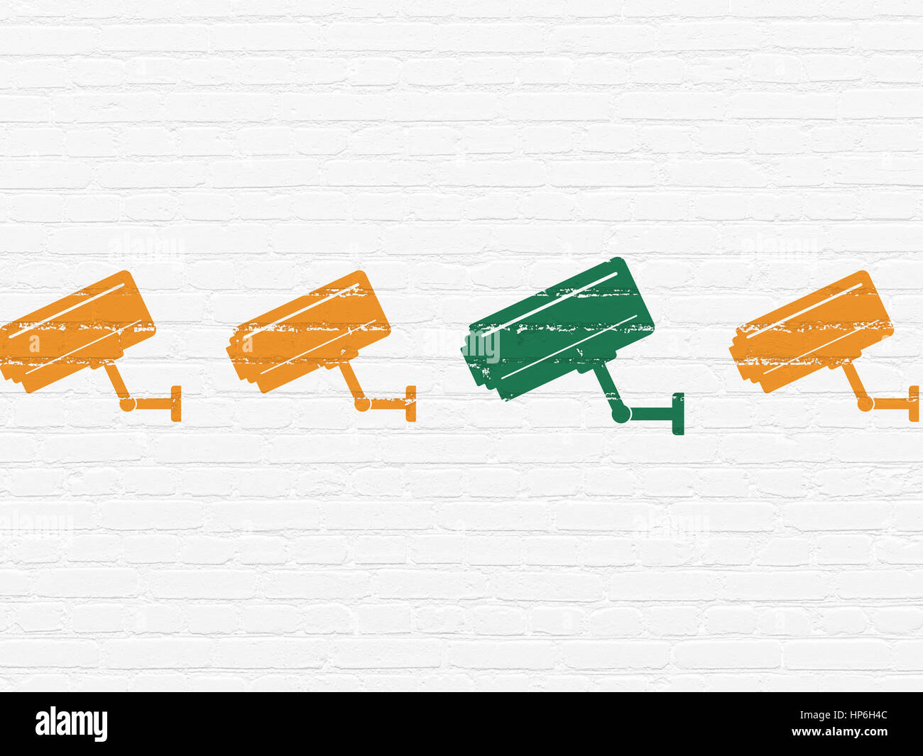 Safety concept: row of Painted orange cctv camera icons around green ...