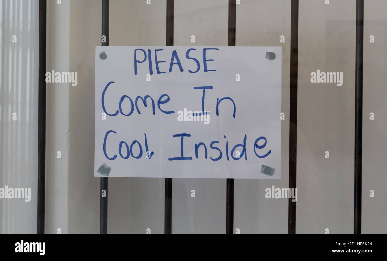 Funny paper sign on the door of a store in Napier, New Zealand Stock ...