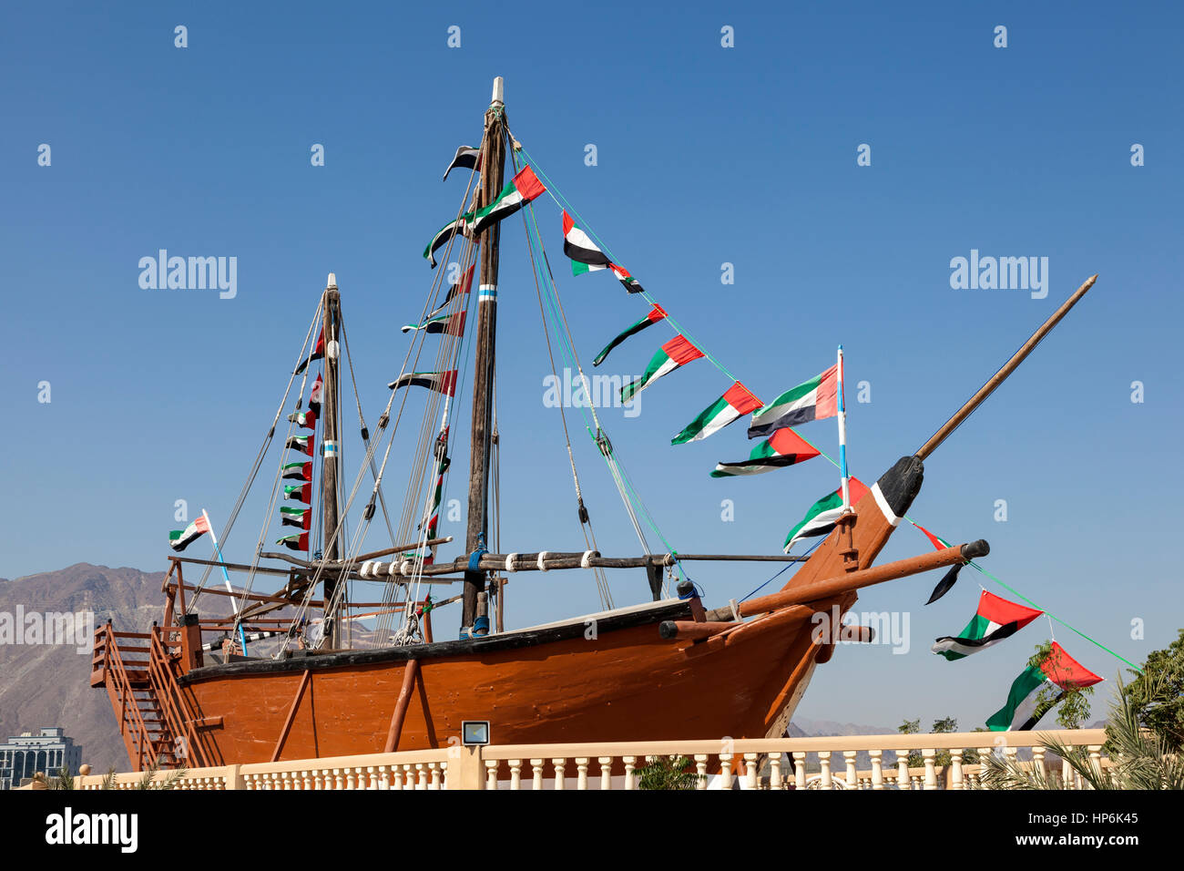 Historic dhow ship at the corniche in Khorfakkan, United Arab Emirates ...