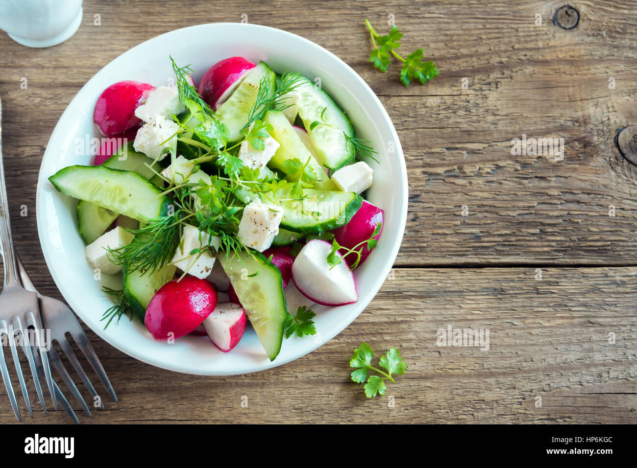 Spring vegetable salad with fresh cucumber, radishes, feta cheese ...