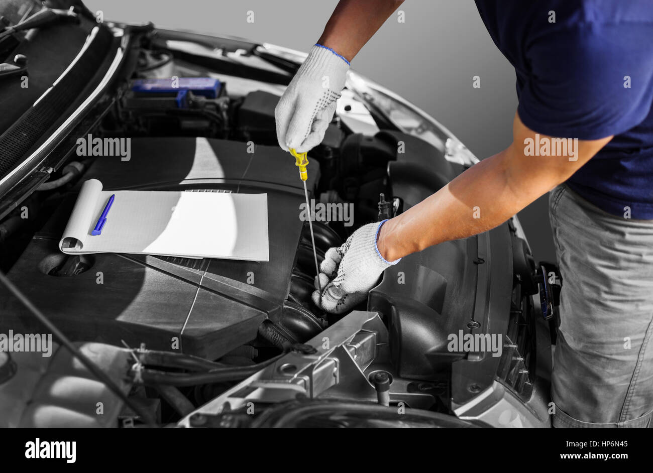 Checking the oil hi-res stock photography and images - Alamy