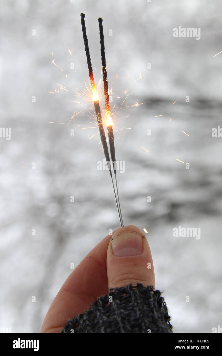 Man holding fireworks hi-res stock photography and images - Alamy