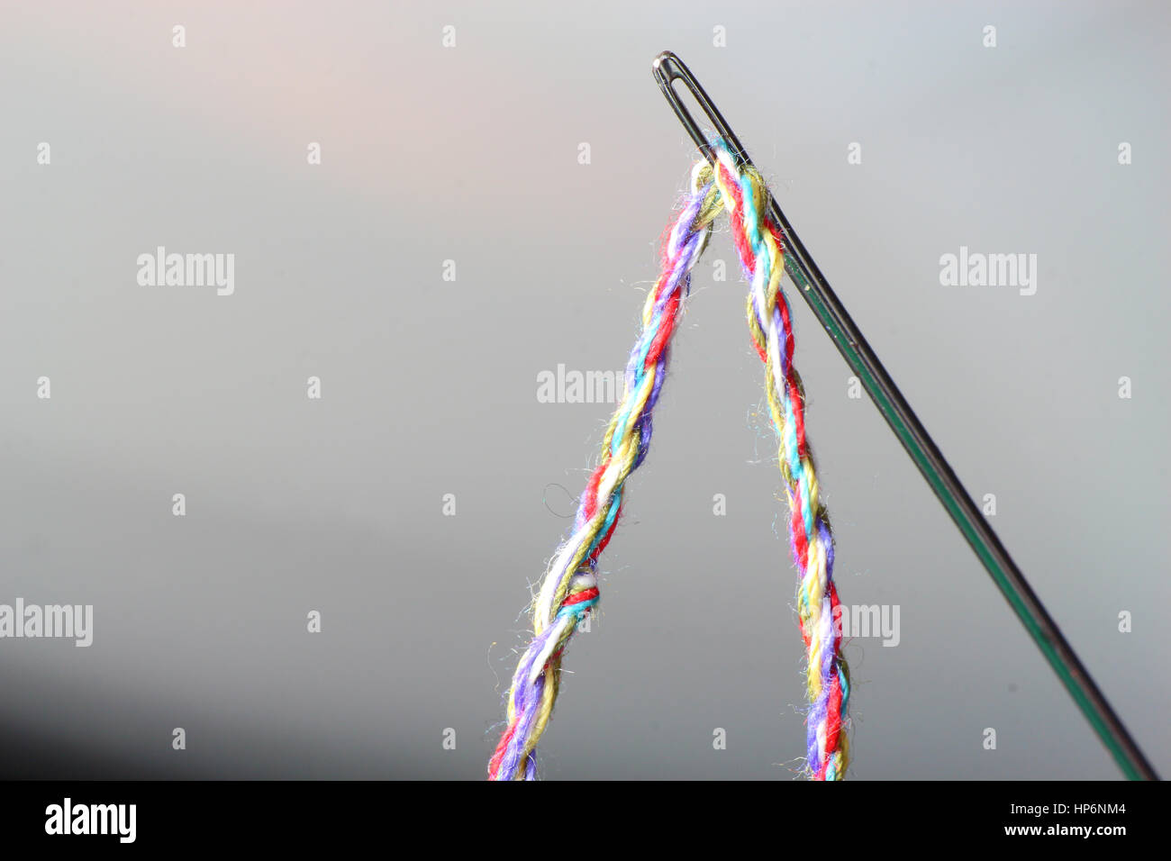 Needle and string Stock Photo - Alamy