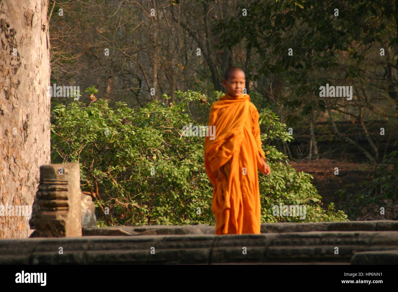 Young child monk walking in Angkor Wat Cambodia Stock Photo - Alamy