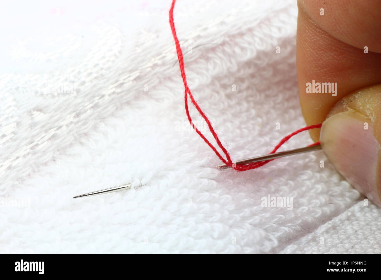 Needle and string Stock Photo - Alamy