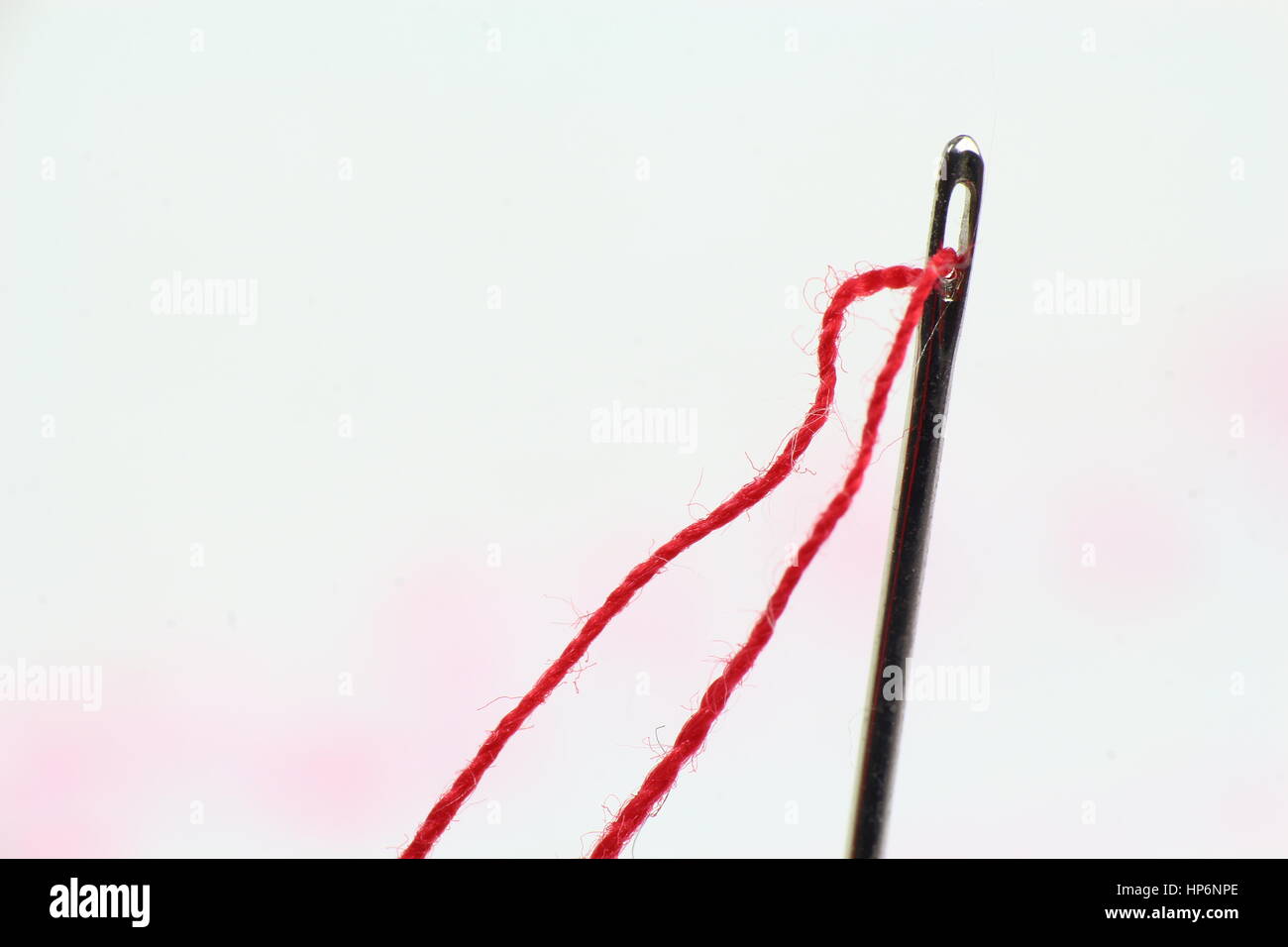 Needle and string Stock Photo - Alamy