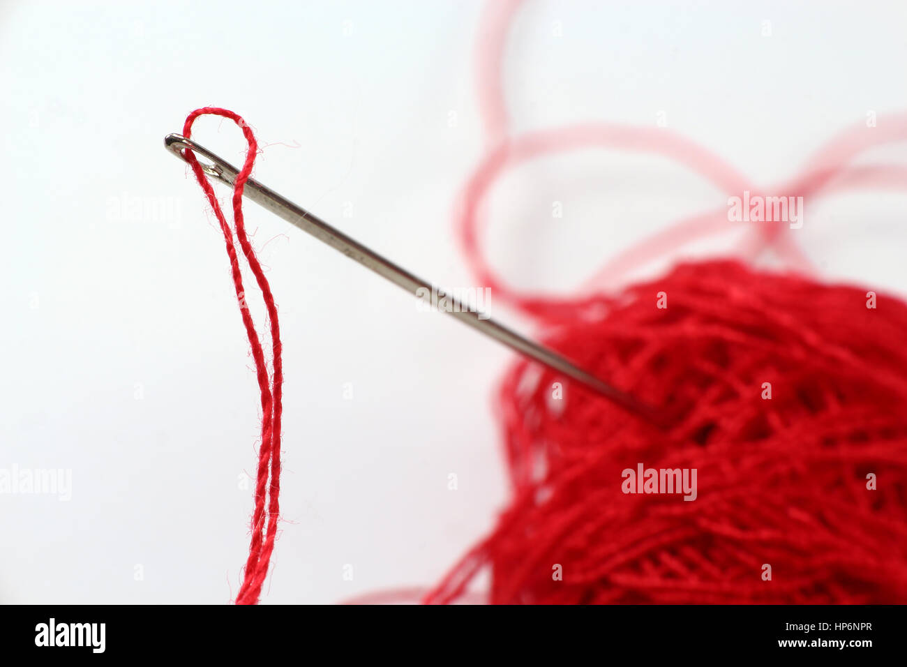 Needle and string Stock Photo - Alamy
