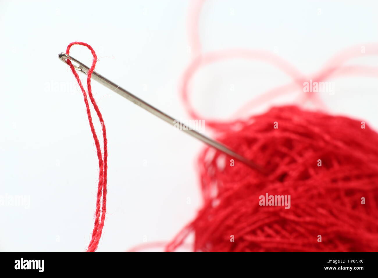 Needle and string Stock Photo - Alamy